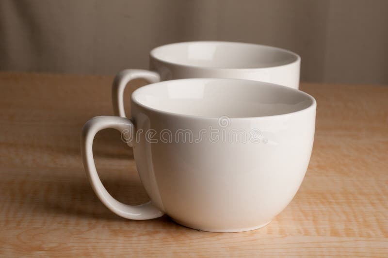 Two Mugs stock image. Image of brown, shadow, empty, mugs - 24066171