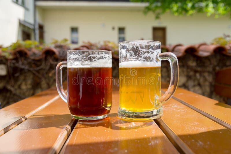 Two Mugs of Beer on a Table at an Outdoor Cafe Stock Image - Image of ...