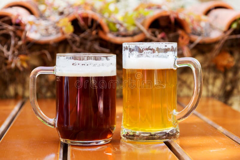 Two Mugs of Beer on a Table at an Outdoor Cafe Stock Image - Image of ...