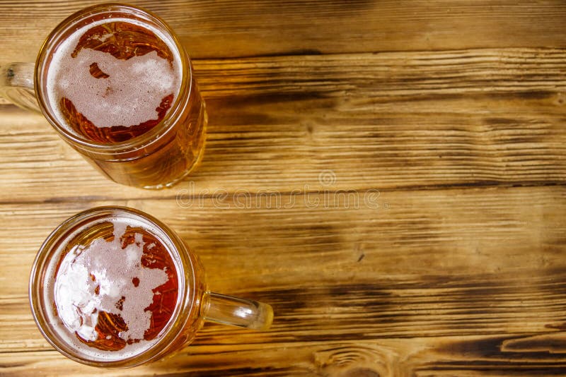 Two Mugs of Beer on Wooden Table. Top View, Copy Space Stock Photo ...