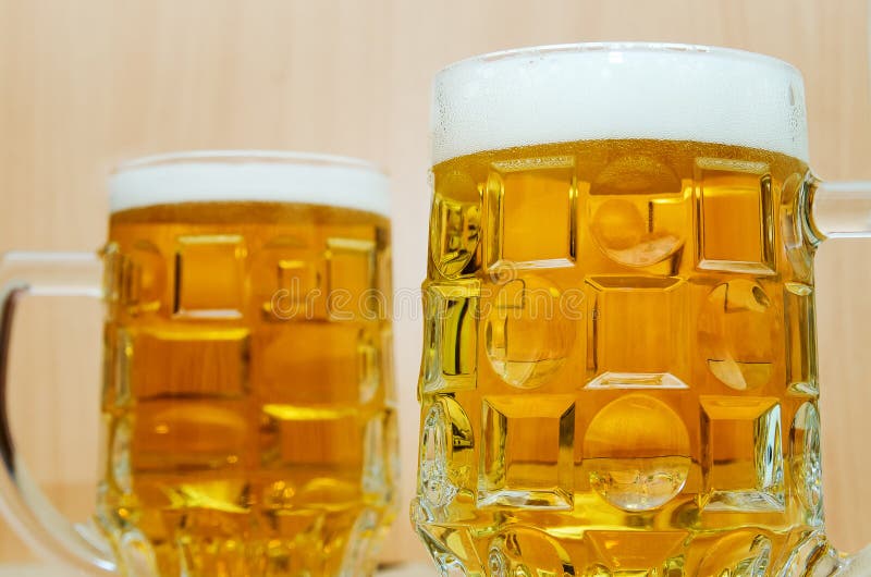 Two Mugs Full with Beer, Closeup Stock Photo - Image of lager, macro ...