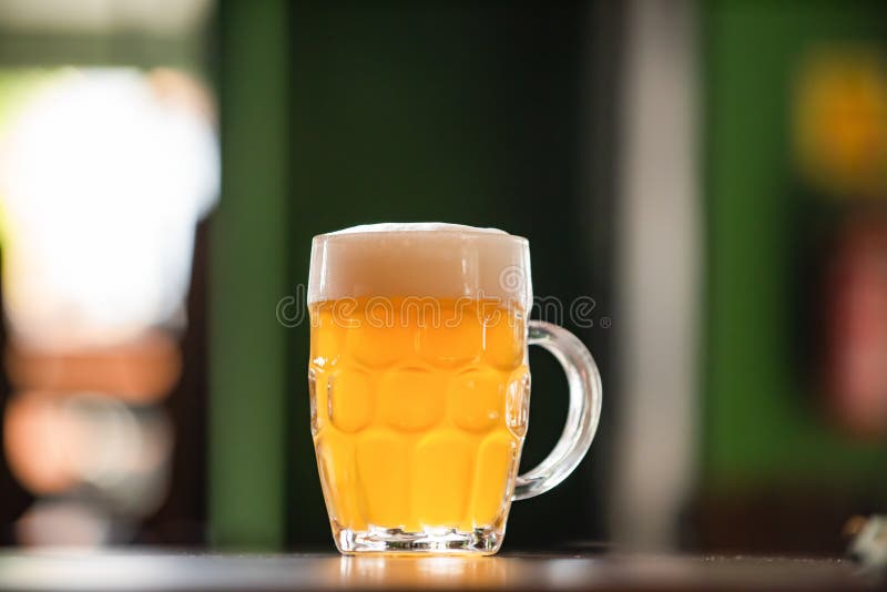 Two Mugs Full of Chopp, with Chopp Pilsen on a Rustic Table. Stock ...