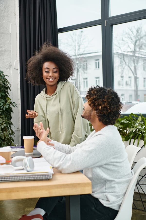 Two Multicultural Students Engrossed in Conversation Stock Image ...