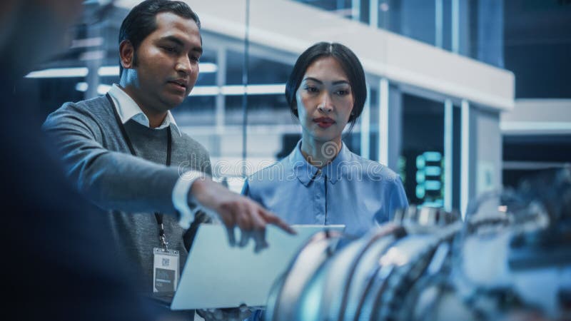 Two Multiethnic Employees Work in Modern Innovative Research Facility ...