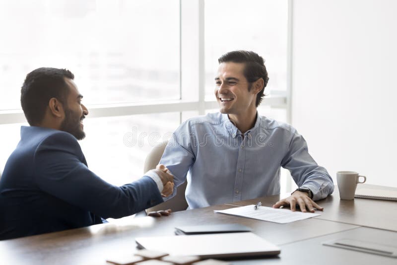 Two Multinational Businessmen Shake Hands, Establishing Professional ...