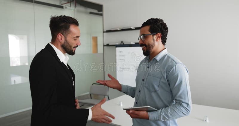 Two Multiracial Men Colleagues, Manager and Client Shaking Hands Stock ...