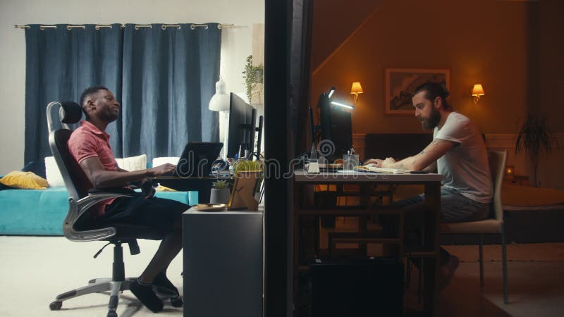 Two Multiracial Neighbours Sit at Computers. Two Apartments Separated ...