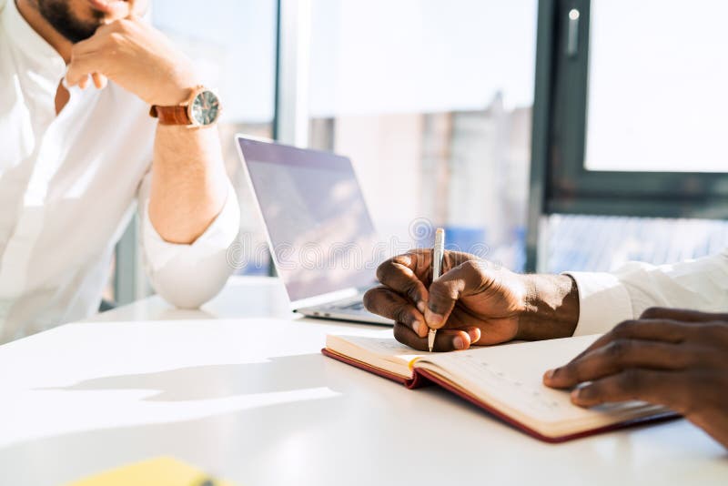 Two Multiracial Office Workers at the Morning Briefing. Stock Photo ...