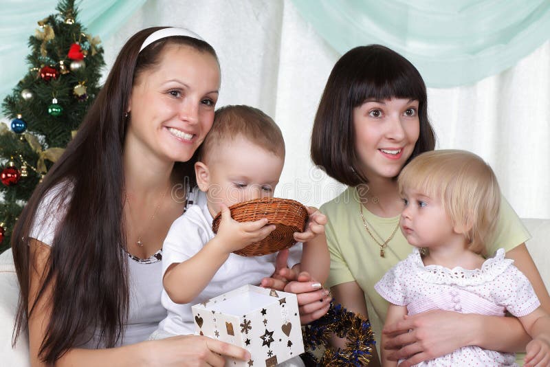 Two Mums and Their Kids Sits Near a Xmas Tree Stock Photo - Image of ...