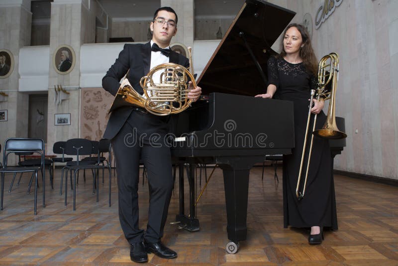 Two Musicians Playing on Wind Instruments Stock Image - Image of blower ...