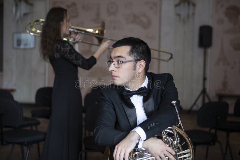 Two Musicians Playing on Wind Instruments Stock Image - Image of ...