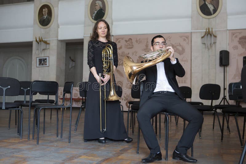 Two Musicians Playing on Wind Instruments Stock Photo - Image of horn ...
