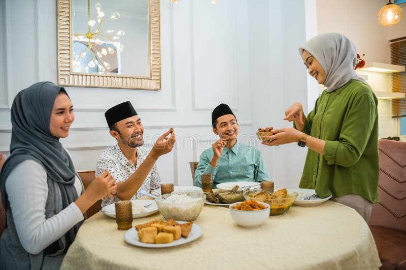 Two Muslim Couples Break Their Fast with Dates Stock Photo - Image of ...