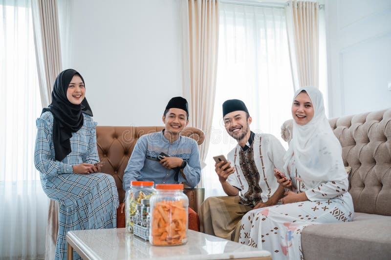 Two Muslim Couples Smiling at the Camera on Eid Day Stock Photo - Image ...