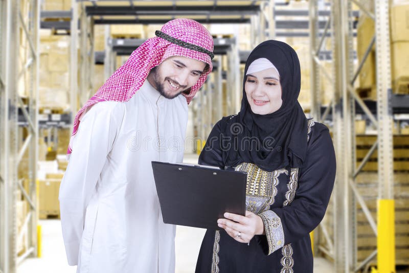 Two Muslim Entrepreneurs Discuss with Clipboard Stock Image - Image of ...