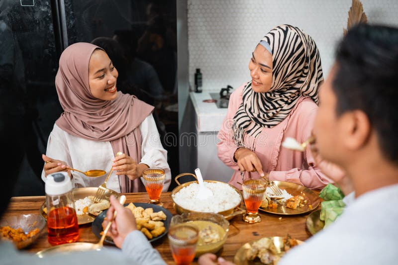 Two Muslim Girl Friend Chatting while Having Iftar Dinner at Home Stock ...
