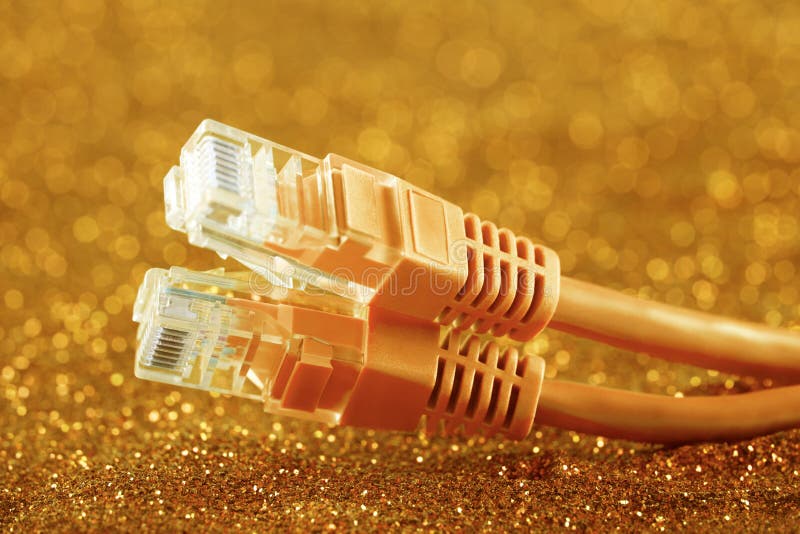 Two Network Cables Over Orange Sparkles Background Stock Photo - Image ...