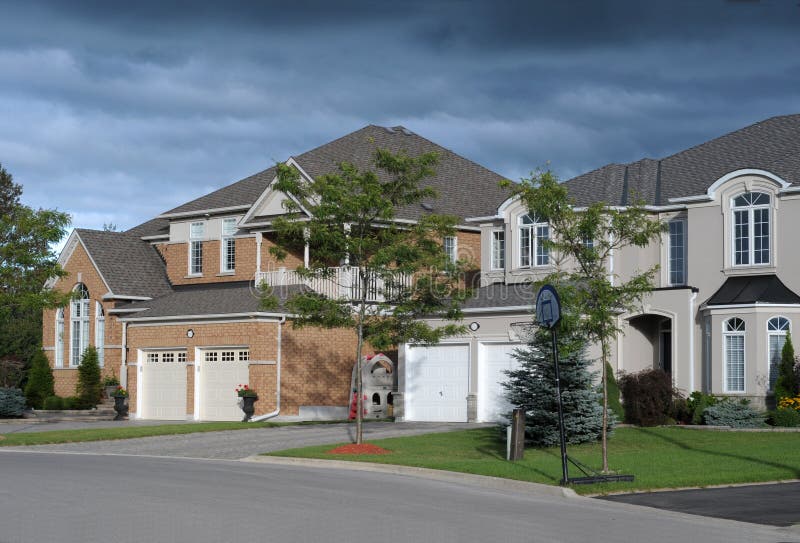 Two new houses stock image. Image of street, garage, lawn - 10724837