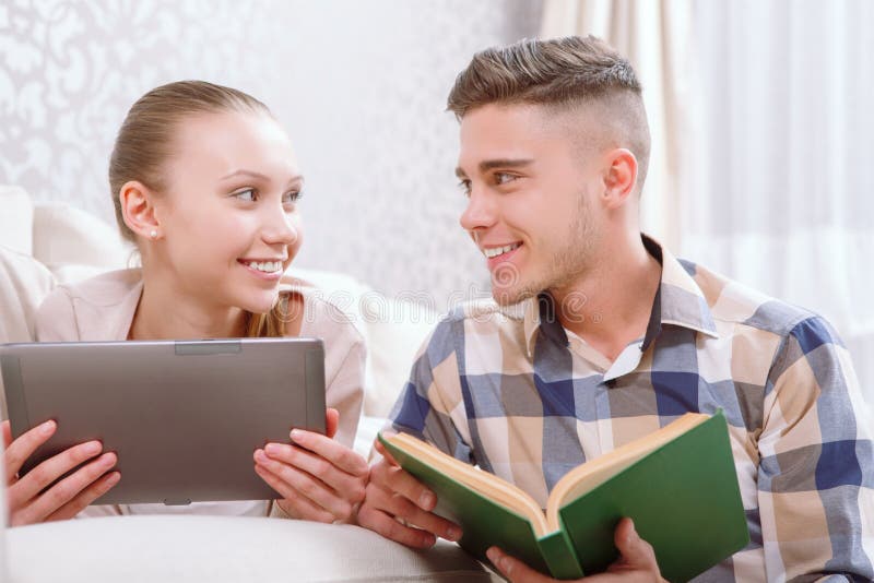 Two Nice Young People Reading Stock Photo - Image of cheerful, read ...