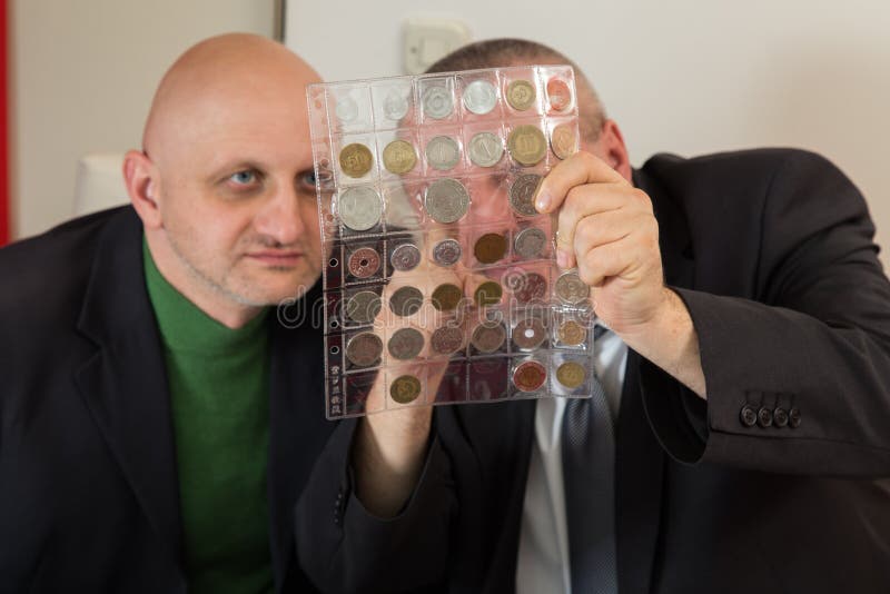 Two Numismatists Examines Collection of Coin Stock Image - Image of ...
