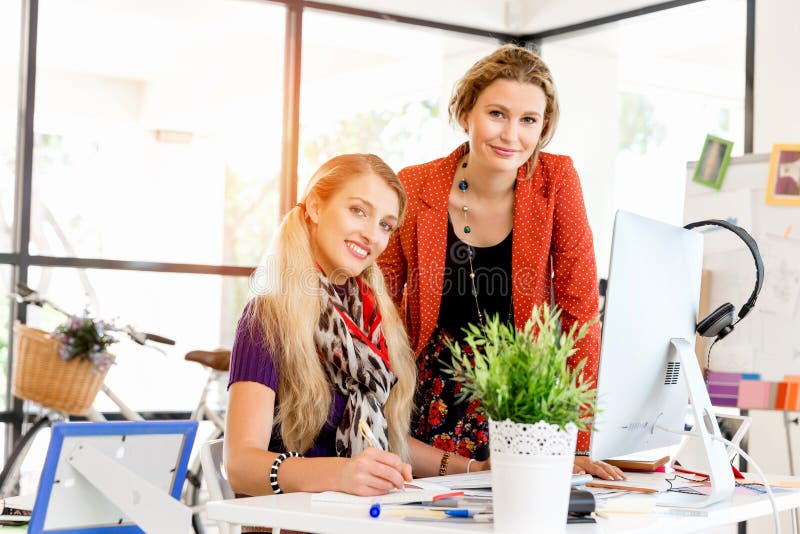 Two Office Workers at the Desk Stock Photo - Image of desk ...