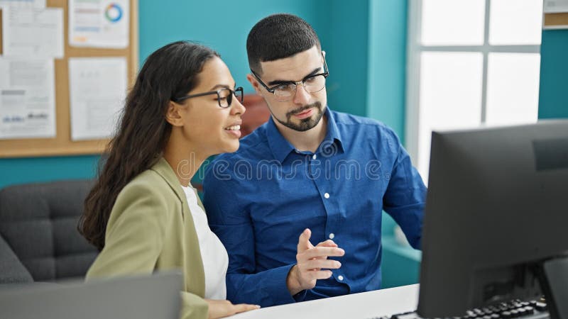 Two Office Workers, Man and Woman, Embrace Technology at Work Stock ...