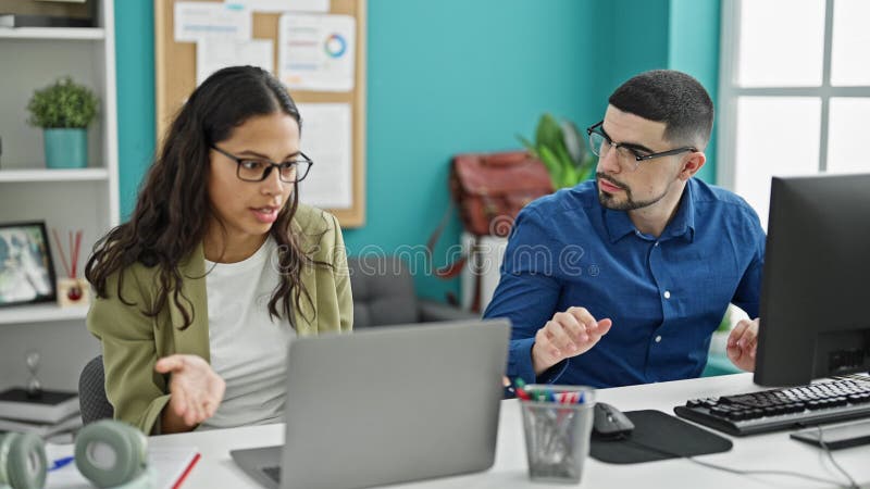 Two Office Workers, a Man and Woman, Sitting at a Table, Entangled in a ...