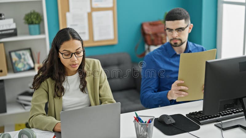 Two Office Workers, a Man and Woman, Sitting at a Table, Entangled in a ...