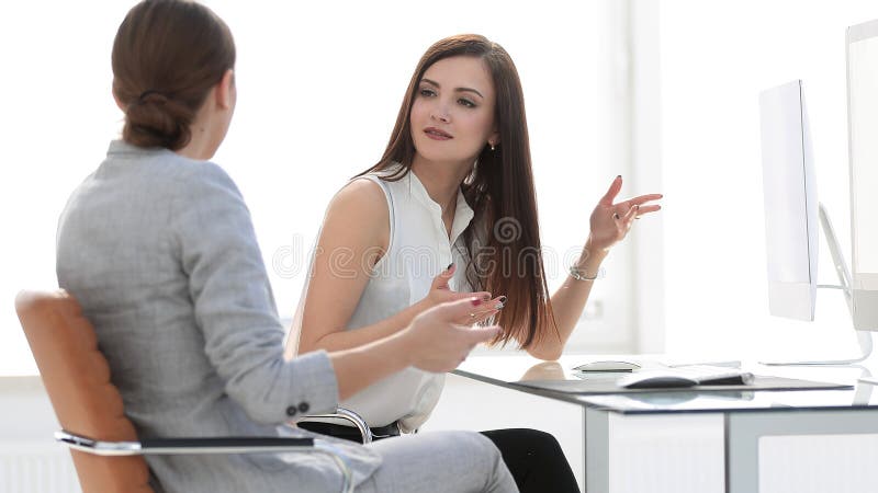 Two Office Workers Talking in the Workplace Stock Photo - Image of ...