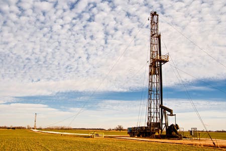 Two Oil Field Pulling Units Stock Photo - Image of pumpjack, outdoors ...