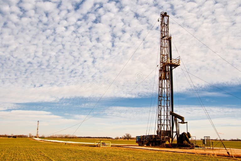 Two Oil Field Pulling Units Stock Photo - Image of pumpjack, outdoors ...