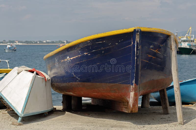 Weathered red rowing boat stock photo. Image of ocean - 11325114