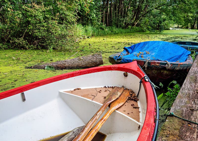 Two old boats in a river stock image. Image of waterway - 270074853