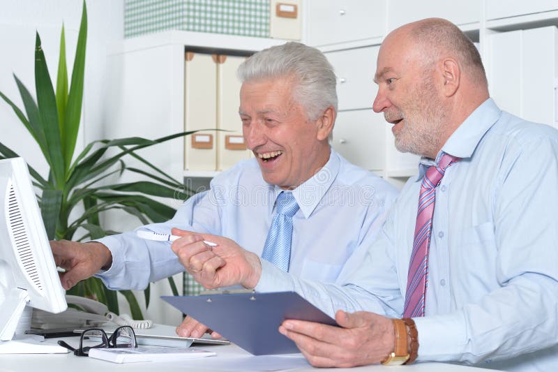 Two Old Business Men Sitting at Desk and Working Stock Image - Image of ...