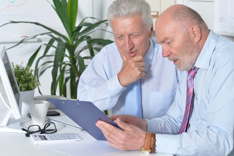 Two Old Business Men Sitting at Desk and Working Stock Image - Image of ...