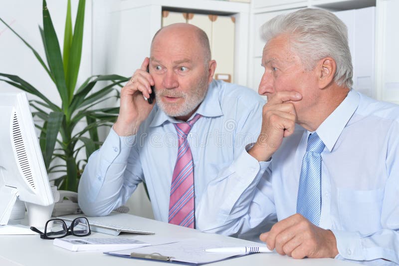 Two Old Business Men Sitting at Desk and Working Stock Image - Image of ...