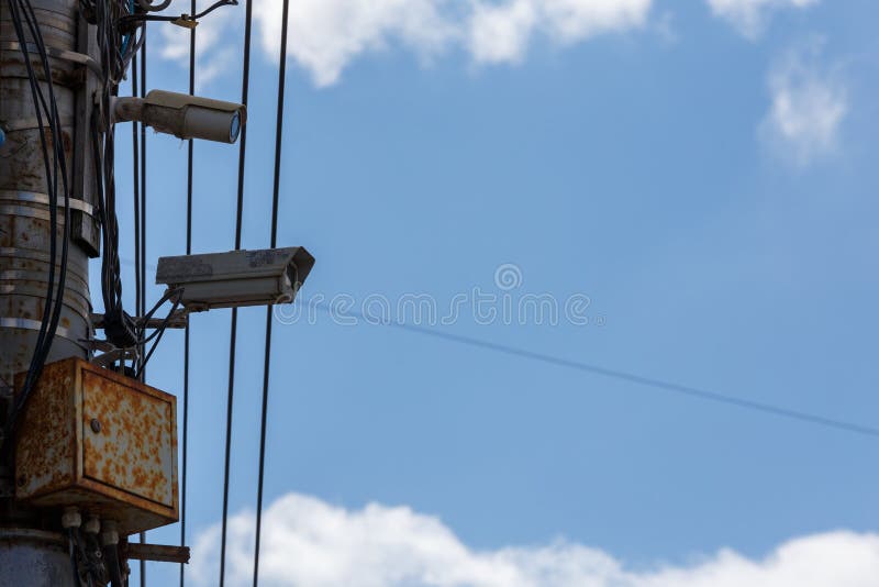 Two Old Cctv Security Surveillance Cameras on Street Light Pole on Blue ...