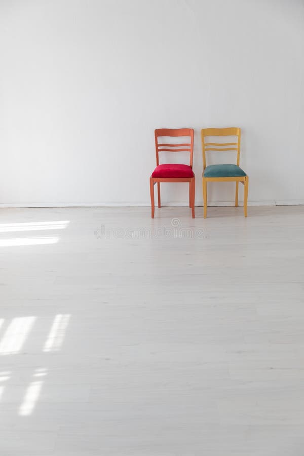 Two Old Chairs of Different Colors in the Interior of a White Room Stock Image - Image of ...