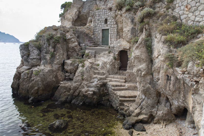 Two Old Doors in a Cliff in a Bay in Dubrovnik Stock Image - Image of ...