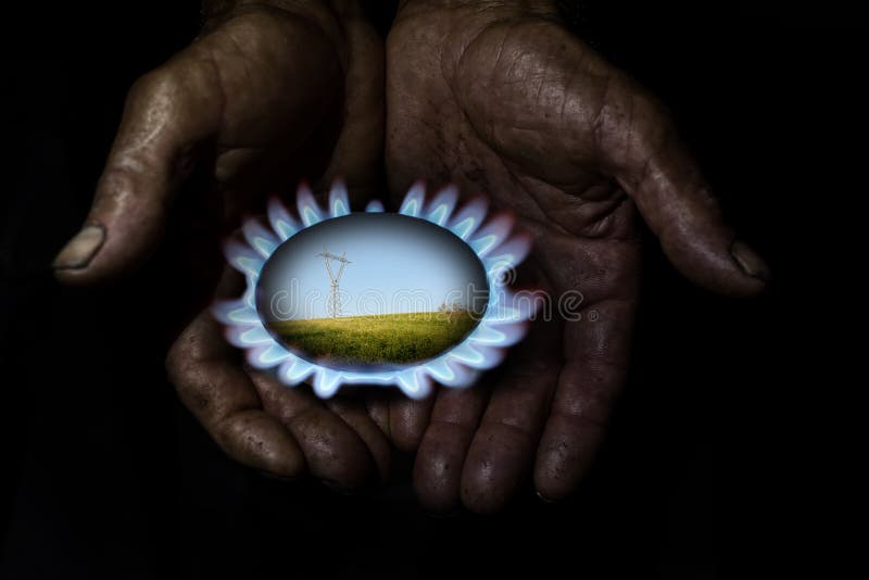 Old Hands Show Two Examples of Energies: Electric and Methan Stock ...