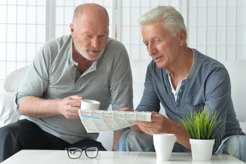 Two Old Men Sitting at Table and Discussing News Stock Image - Image of ...
