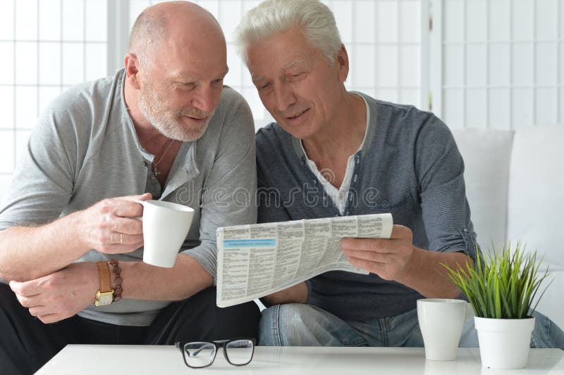 Two Old Men Sitting at Table and Discussing News Stock Photo - Image of ...