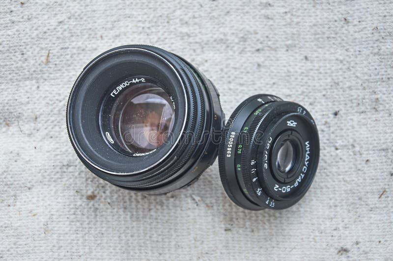 Two Old Photo Lenses are Lying on a Fabric Backing Stock Photo - Image ...