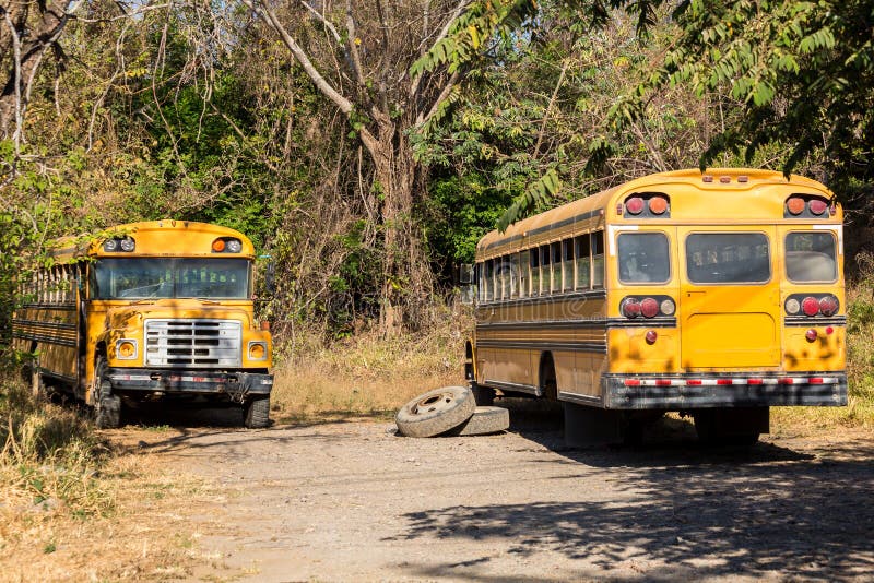 Two old rusty school bus stock image. Image of wheels - 63890843