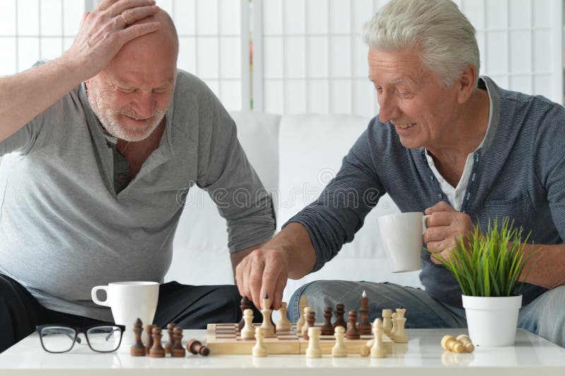 Two Old Men Sitting at Table and Playing Video Game Stock Photo - Image ...