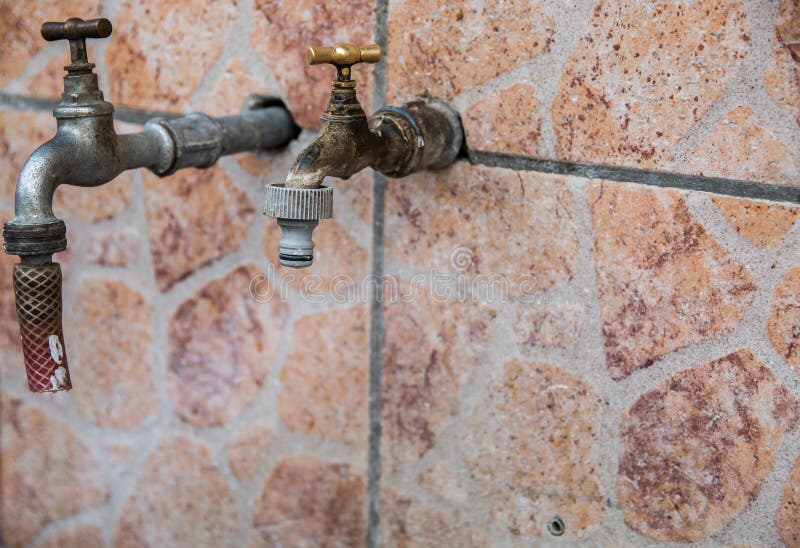 Two Old Water Taps at a Outdoor Tile Wall Stock Image - Image of ...