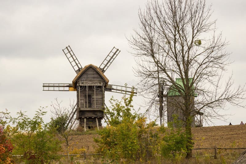 Two Old Wooden Mills on a Hill. a Tree without Leaves Stock Photo ...