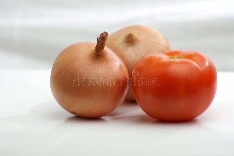 Two onion bulbs and tomato stock image. Image of tomato - 12101915