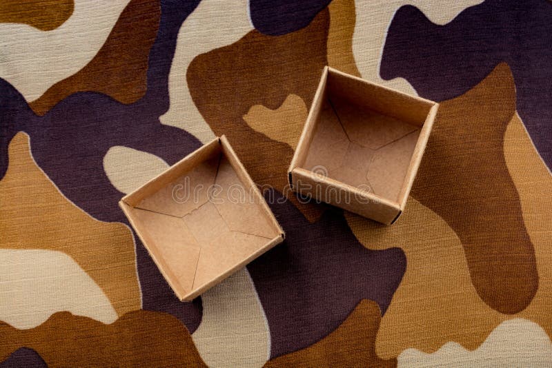 Two Open Cardboard Boxes on Camouflage Background Stock Image - Image ...