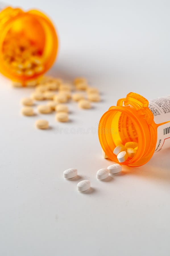 Two Open Pill Bottles with Partial Label Showing Stock Photo - Image of ...